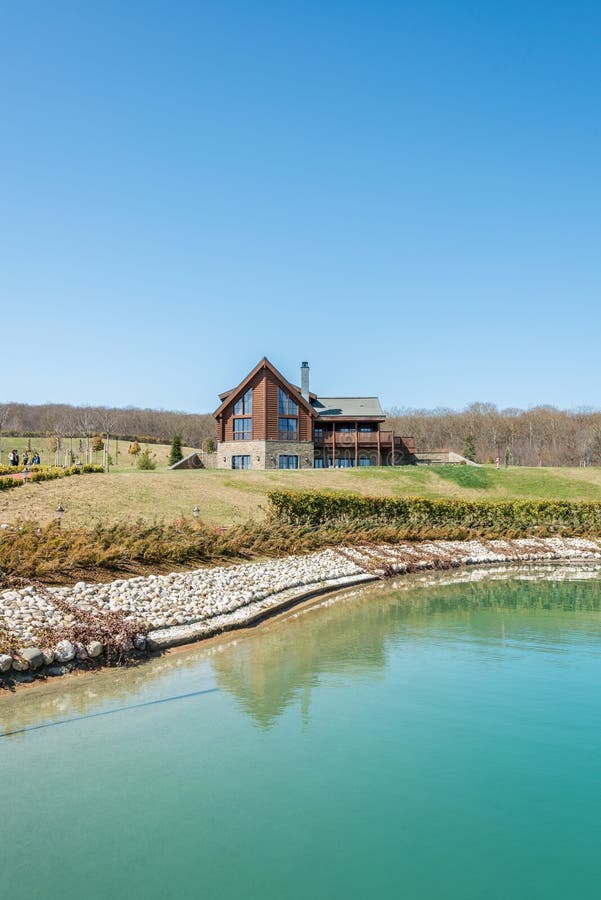 Modern House Near Water on Bright Day Stock Image - Image of logs ...