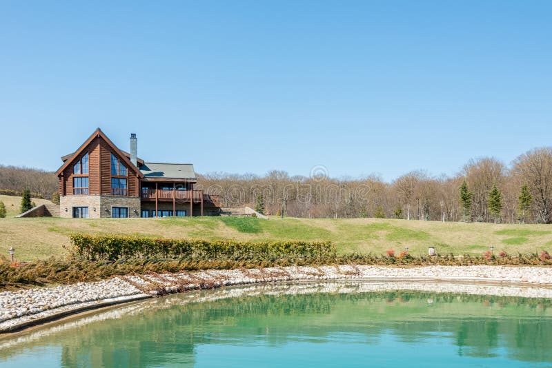 Modern House Near Water on Bright Day Stock Image - Image of hotel ...