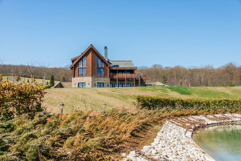 Modern House Near Water on Bright Day Stock Photo - Image of exterior ...