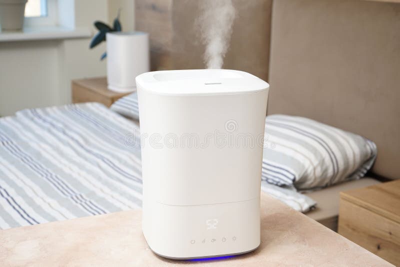 Modern Humidifier in the Bedroom. Ultrasonic Humidifier in the House ...