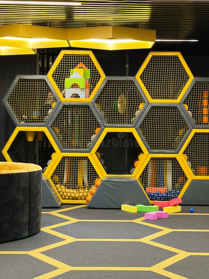 Modern Indoor Playground Area with Vibrant Colors and Hexagonal Design ...