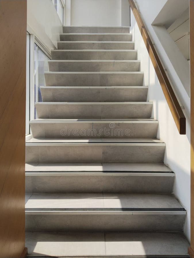 Modern Indoor Staircase with Sunlight and Shadows Stock Image - Image ...
