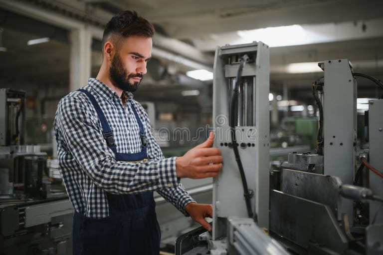 Modern Industrial Machine Operator Working in Factory Stock Photo ...