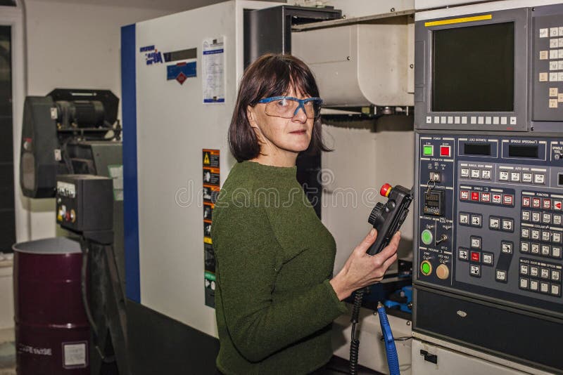 Cute Woman Cnc Machine Operator at Work. Stock Image - Image of ...