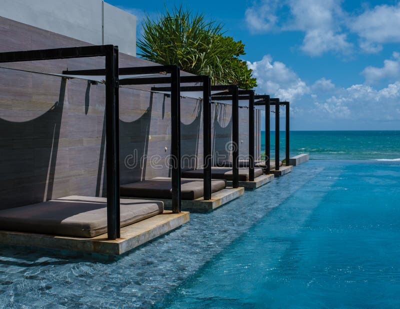 Modern Infinity Pool at the Beach Stock Image - Image of hotel, people ...