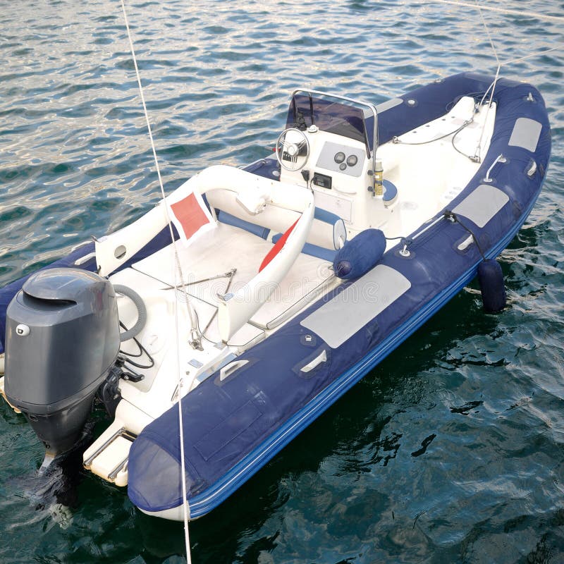 Modern Inflatable Boat with Engine in the Sea Near Shore Stock Image ...