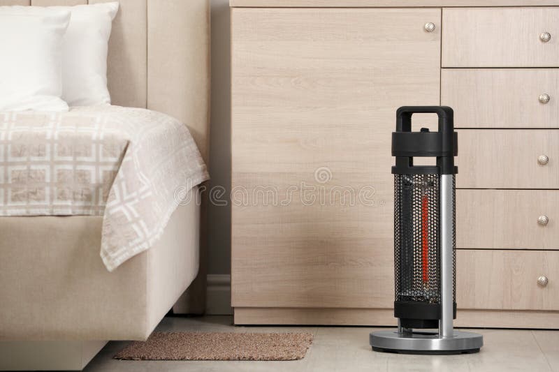 Modern Infrared Heater on Floor in Bedroom Stock Photo - Image of ...