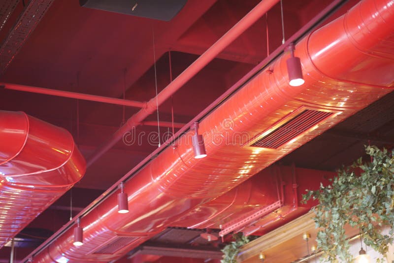 Modern Interior Design Features Vibrant Red Ductwork and Lighting Stock ...