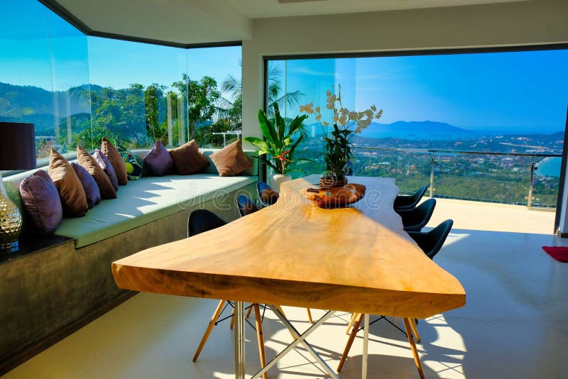 Modern Interior of a Dining Room with Panoramic Windows Looking at a ...