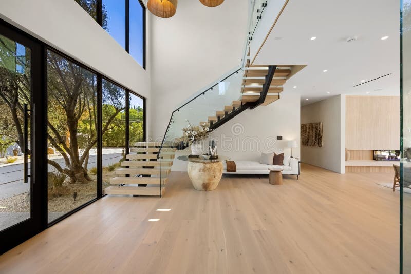 Modern Interior with Open Staircase and Large Windows Stock Photo ...