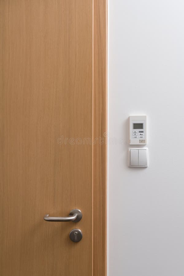 Modern Interior with Wooden Door and Control Panel Stock Image - Image ...