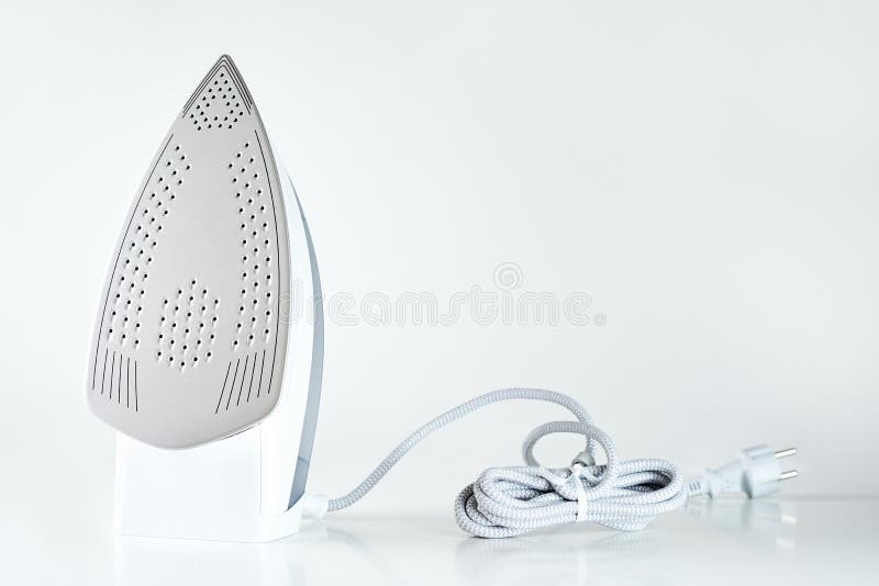 Modern Iron with Cable on White Background Stock Photo - Image of wear ...