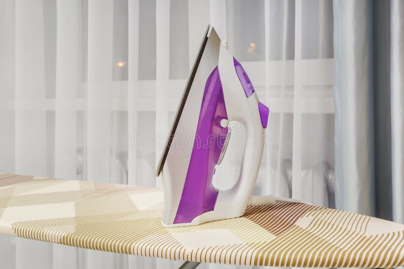 Modern Iron on Ironing Board Stock Photo - Image of board, equipment ...