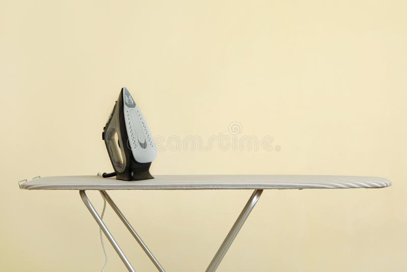 Modern Iron on Ironing Board, Space for Text Stock Image - Image of ...