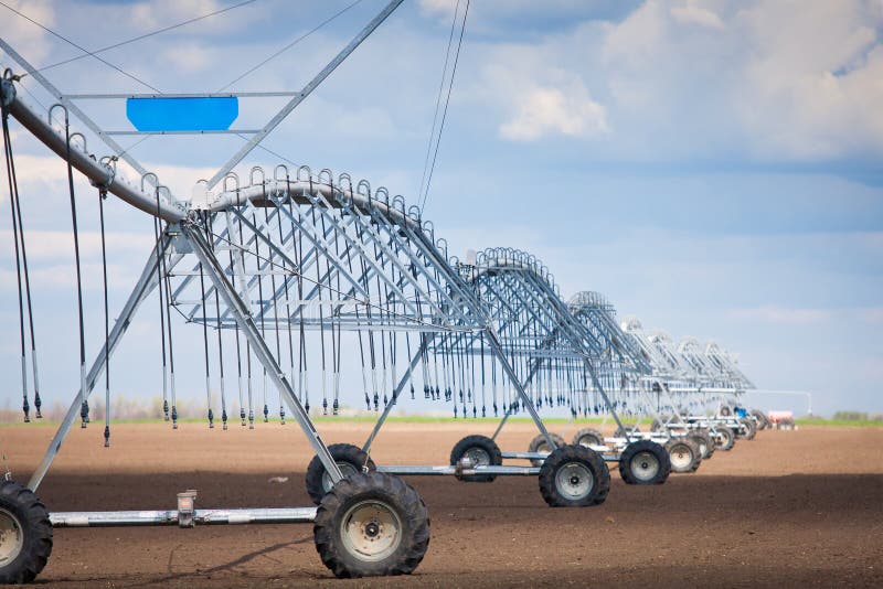Modern Irrigation System Watering A Farm Field Stock Image - Image of ...