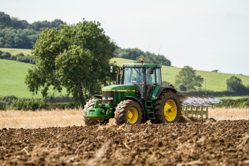 Modern John Deere Tractor Pulling a Plough Editorial Photo - Image of ...