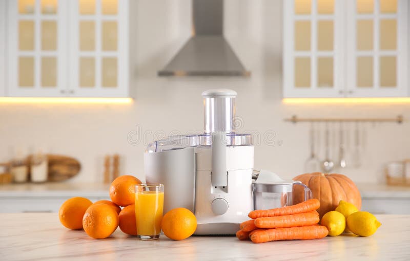Modern Juicer, Fresh Vegetables and Fruits on Table in Kitchen Stock ...