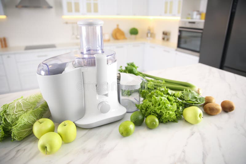 Modern Juicer, Fresh Vegetables and Fruits on Table in Kitchen Stock ...