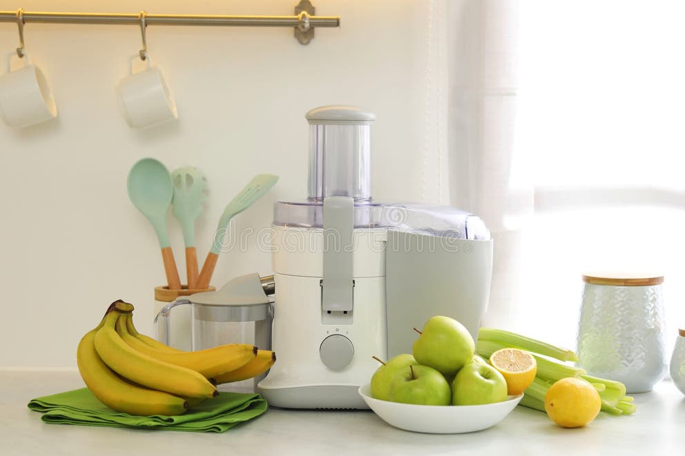 Modern Juicer and Fruits on White Counter in Kitchen Stock Photo ...