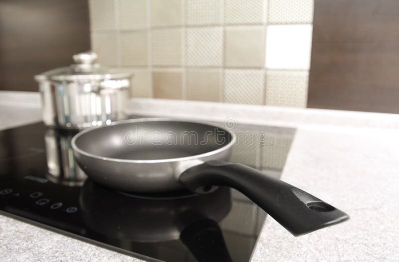 Modern Kitchen Appliances. Pot and Pan on a Cooker Stock Image - Image ...