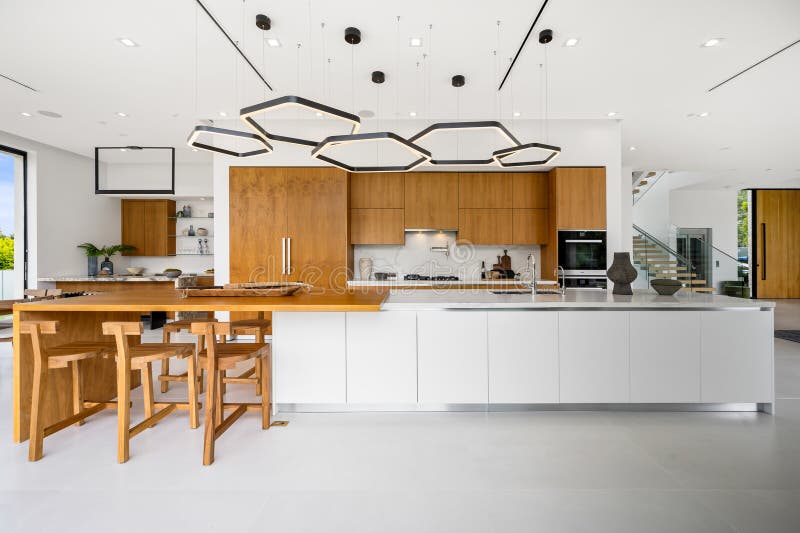 Modern Kitchen with Central Island and Two Stools at the Counter Stock ...