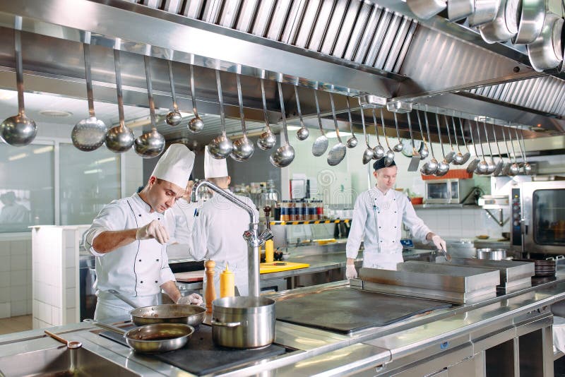 Modern Kitchen. Cooks Prepare Meals on the Stove in the Kitchen of the ...