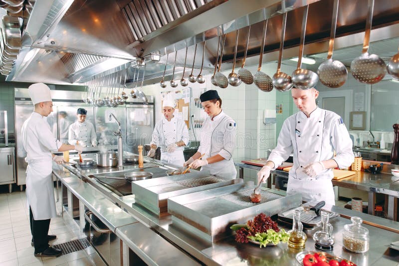 Modern Kitchen. Cooks Prepare Meals on the Stove in the Kitchen of the ...