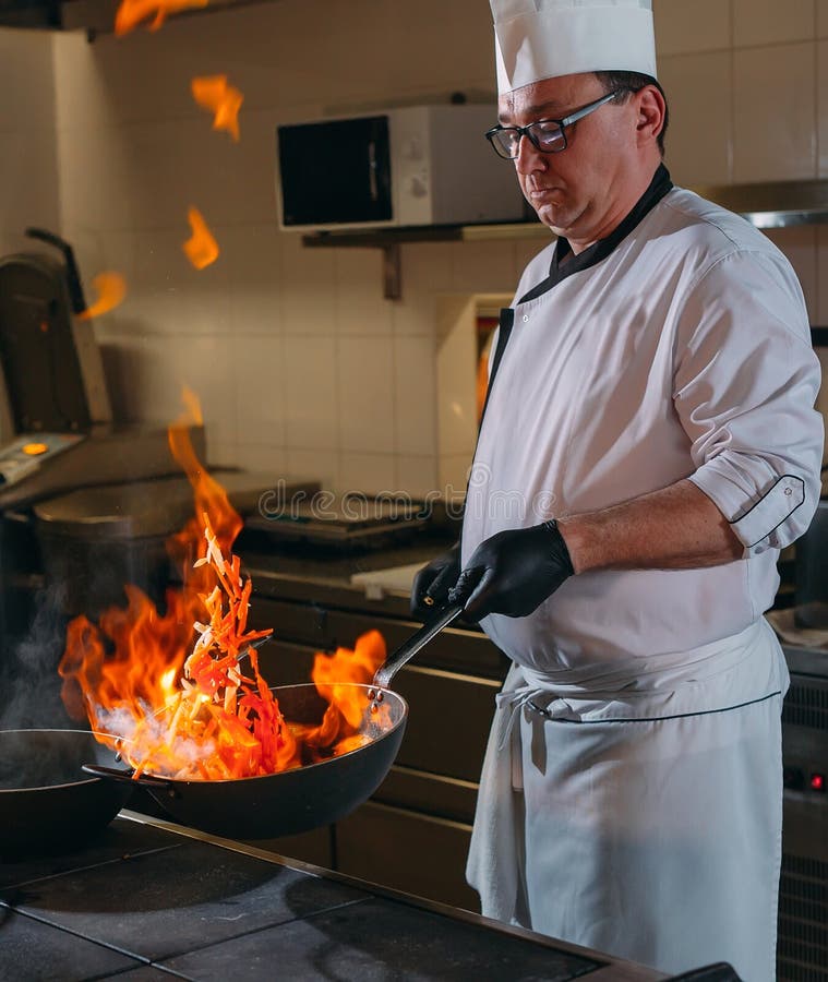 Modern Kitchen. Cooks Prepare Meals on the Stove in the Kitchen of the ...