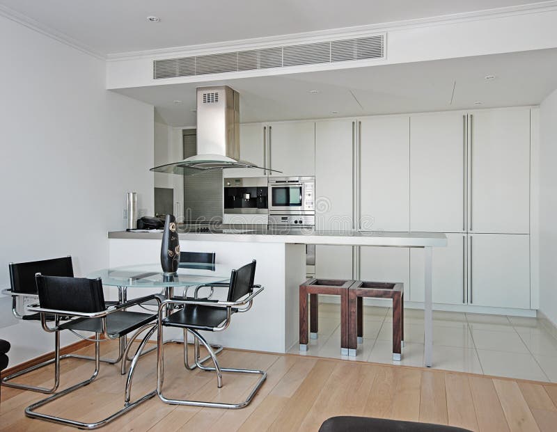 Modern Kitchen with Dining Table Stock Image - Image of diner, flower ...