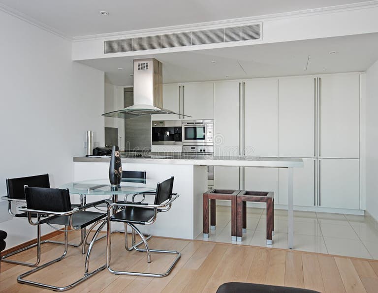 Modern Kitchen with Dining Table Stock Image - Image of diner, flower ...