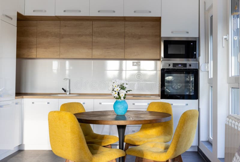 Modern Kitchen and Dining Table in Small Apartment Stock Image - Image ...