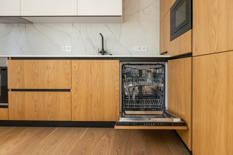 Modern Kitchen with Empty Built-in Dishwasher with Opened Door ...