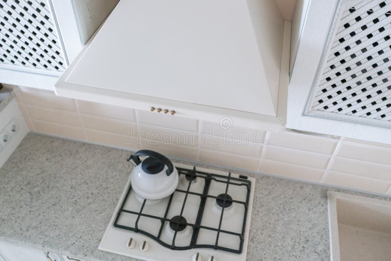 A Modern Kitchen Interior Design, Range Hood Over the Cooking Oven ...