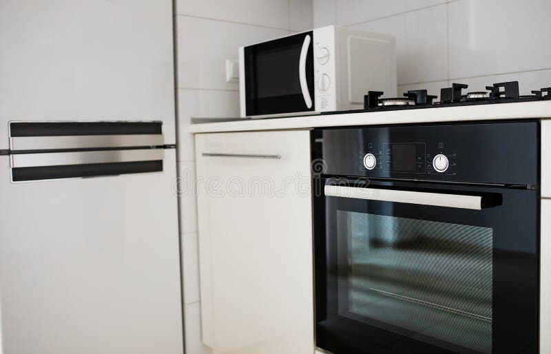 Modern Kitchen Interior with Electric and Microwave Oven. Stock Image ...
