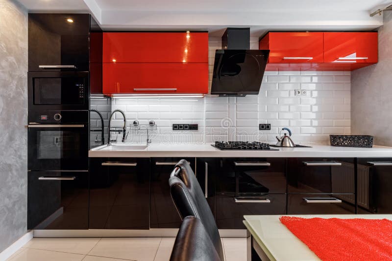 Modern Kitchen Interior with Red and Black Cabinets and White Ceramic ...