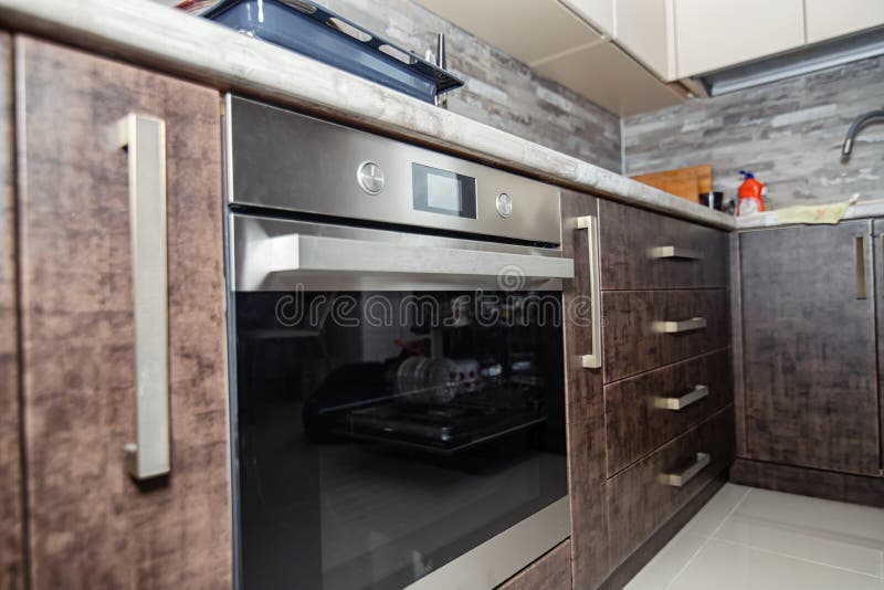 Modern Kitchen Interior in Wenge Colors with Built-in Appliances Stock ...