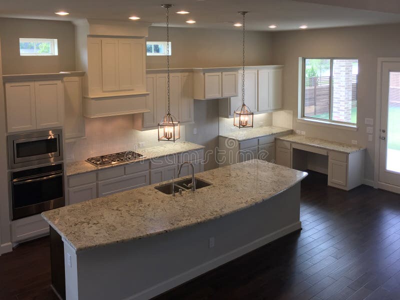 Kitchen with Island Counter Design in a New House Stock Photo - Image ...