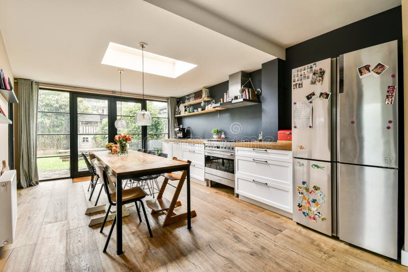 Modern Kitchen with Natural Light Stock Photo - Image of chairs ...