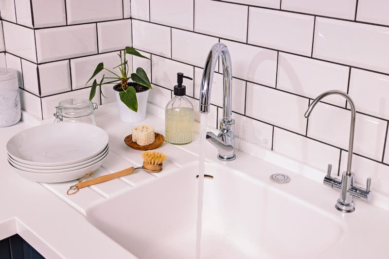 Modern Kitchen with Natural Material Washing Tools and Green Plants ...