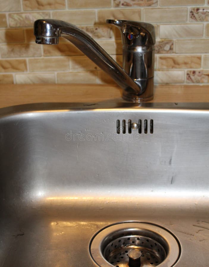 Modern Kitchen Sink, Orange Tone Stock Image - Image of iron, lighting ...