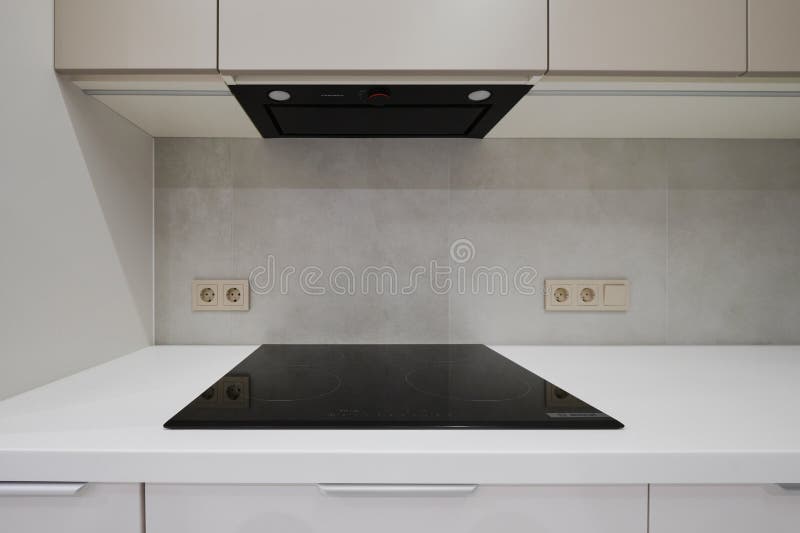 Modern Kitchen with Sleek Induction Stovetop and Minimalist Design ...