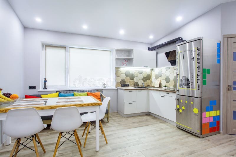 Small Kitchen Studio. a Table with Fashionable Chairs, a Sofa with ...