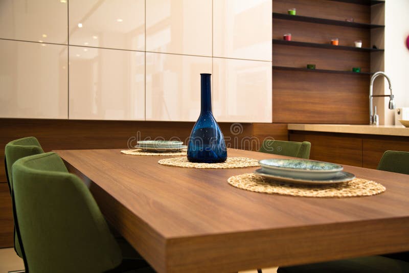 Modern Kitchen, Wooden Walnut Dining Table and Green Chairs Stock Photo ...