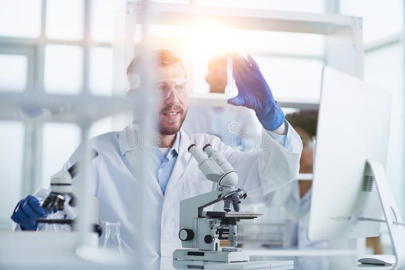 In a Modern Laboratory Research Scientist Conducts Experiments Stock ...