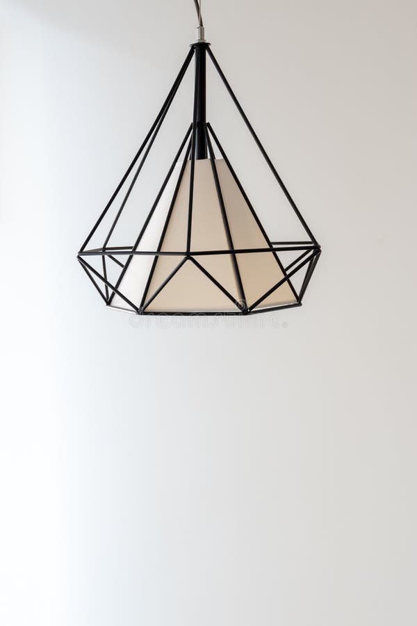 Modern Lamp Hanging Down from Ceiling on White Wall Background Stock ...