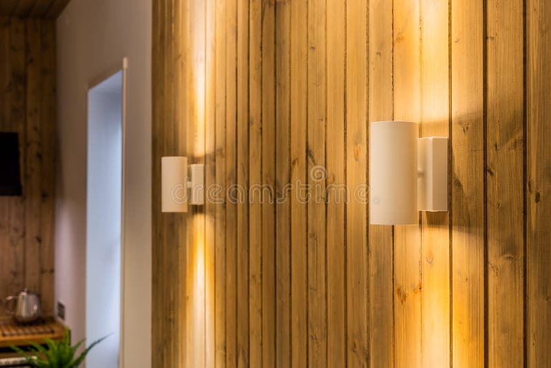 Modern Lamps on a Wooden Wall in the Interior of the House. Stock Photo ...