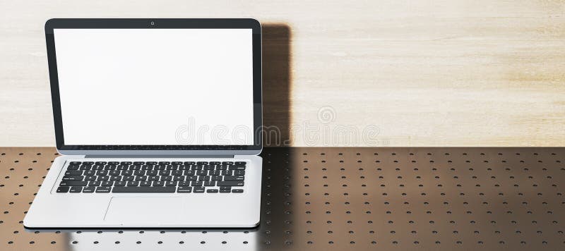 Modern Laptop with Blank Screen on a Perforated Metallic Surface and ...