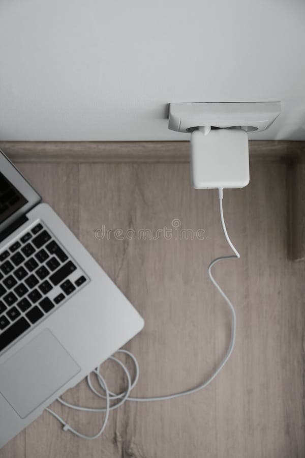 Laptop Charging from Electric Socket, Top View Stock Image - Image of ...