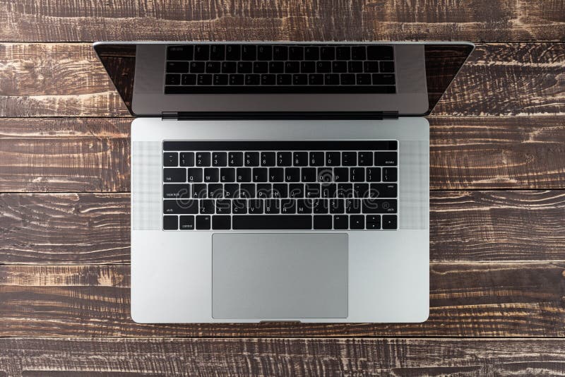 Modern Laptop Computer on Wood Desk Top View Stock Image - Image of ...
