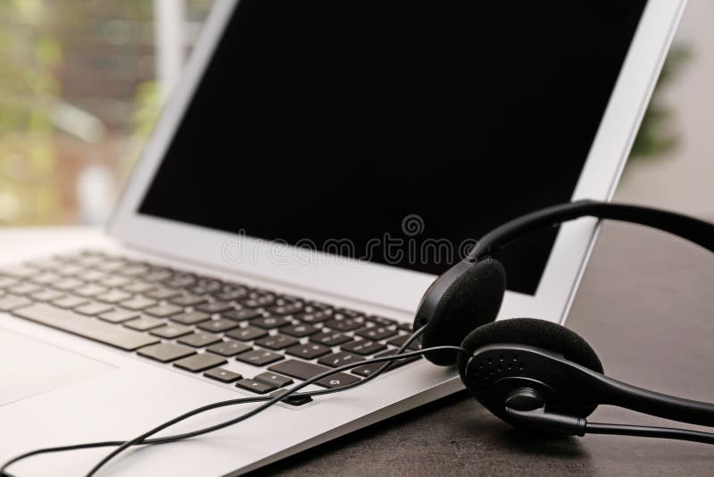 Modern Laptop and Headset on Table Stock Image - Image of modern ...